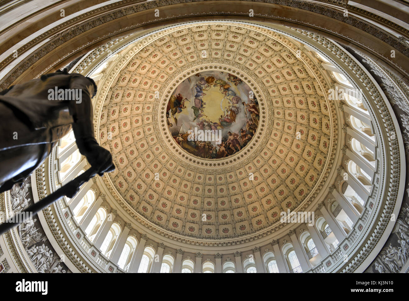 The dome inside of US Capitol in Washington DC beside the statue of ...