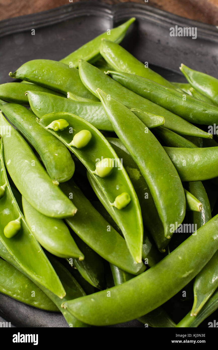 Fresh green sweet pea beans close up Stock Photo - Alamy