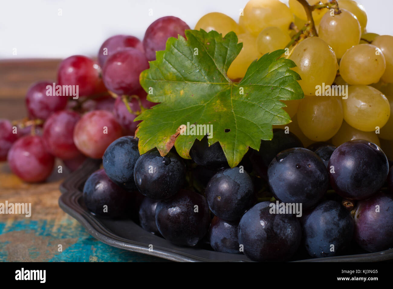Large organic table grape Globe in assortment served on the tin plate ...