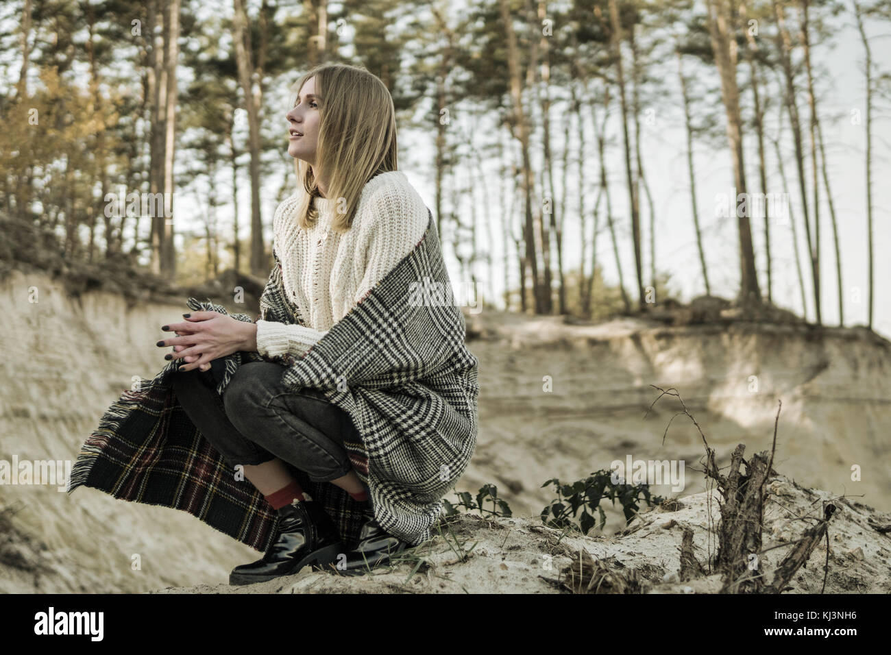 Woman squatting forest hi-res stock photography and images - Alamy