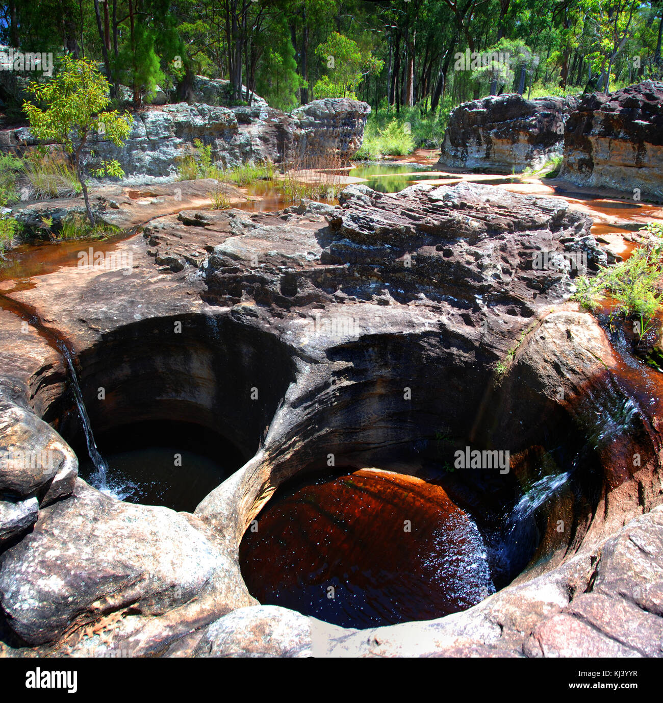Deep potholes in the bedrock of Mimosa Creek at Blackdown Tablelands ...