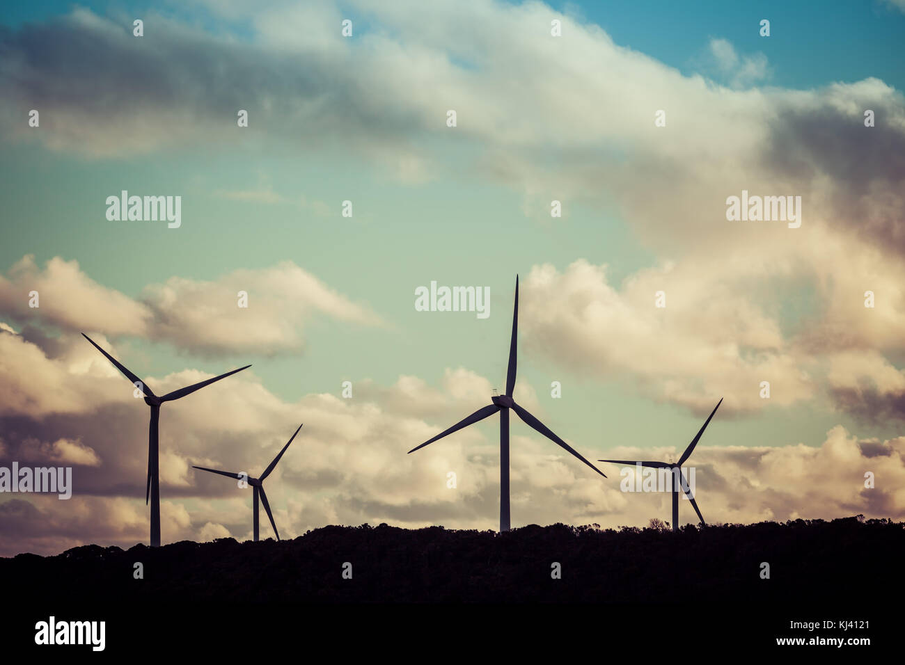Silhouettes of four wind turbines at beautiful sunset Stock Photo - Alamy