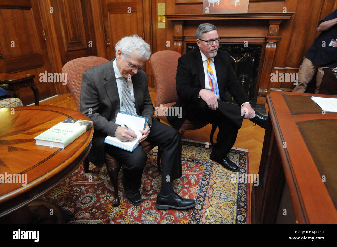 This image features Jim Justice, captured in a candid moment, possibly ...