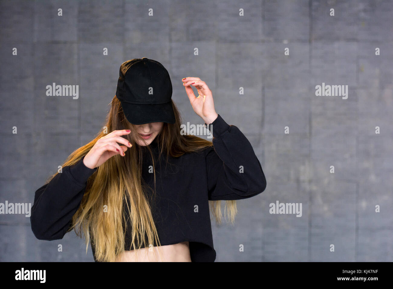 Woman dancer in black cap Stock Photo - Alamy