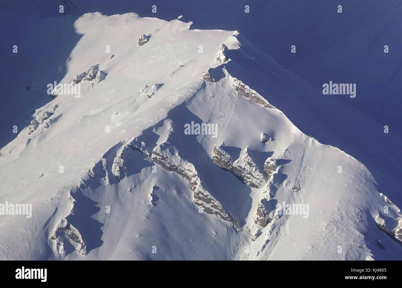 This aerial photograph showcases a stunning mountain peak scene ...