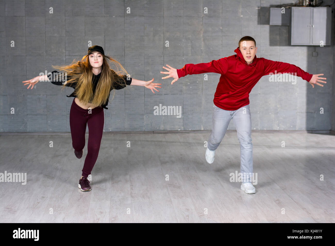 Guy and girl in dance movement Stock Photo - Alamy
