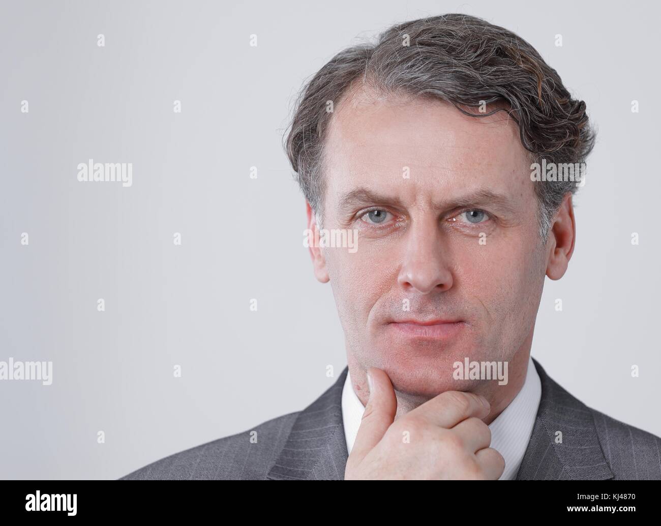 closeup face of a serious businessman Stock Photo - Alamy