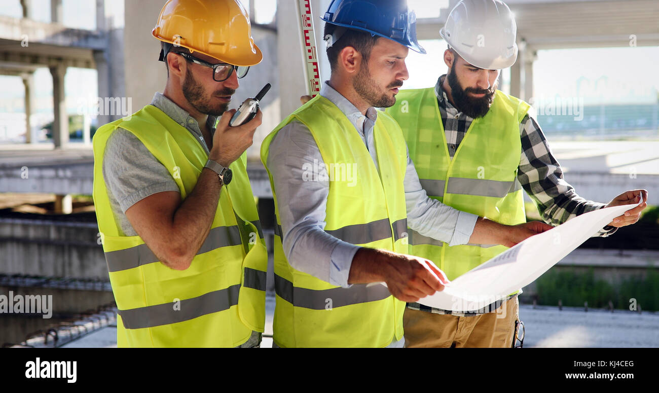 Group engineers architects working together hi-res stock photography ...