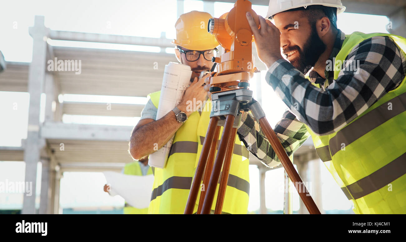 Team of architects people in group on construciton site Stock Photo - Alamy