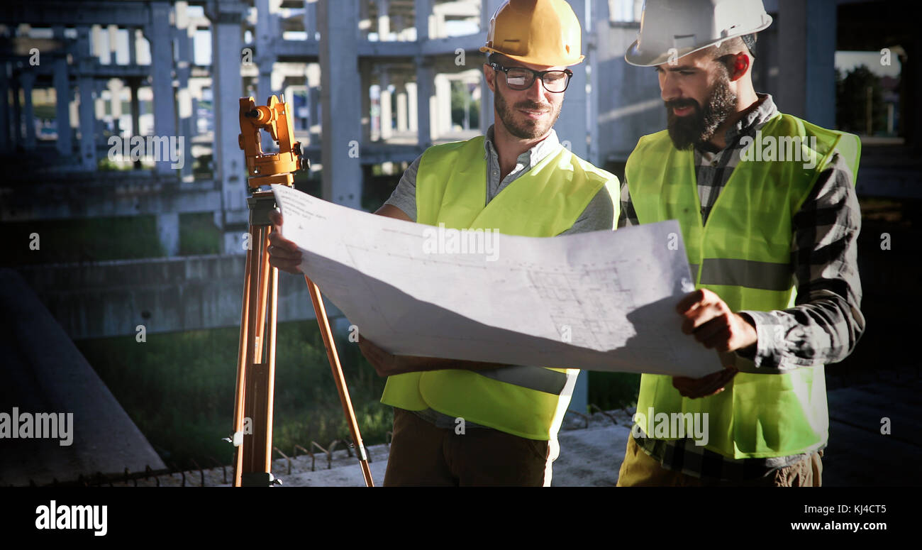 Portrait of construction engineers working on building site Stock Photo ...