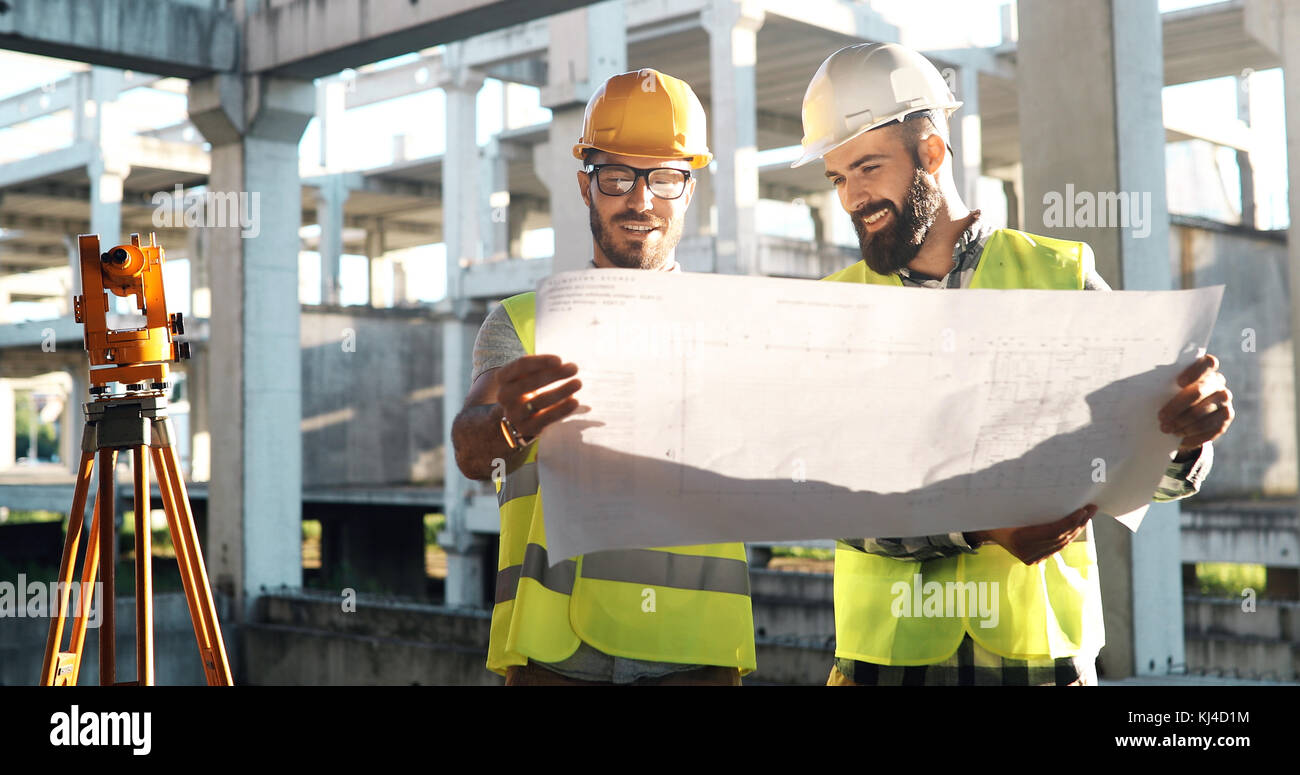 Team of architects people in group on construciton site Stock Photo - Alamy