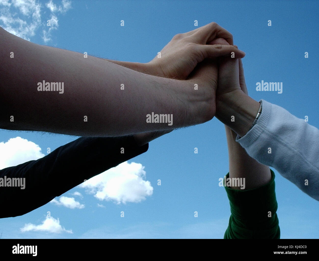Team touching hands Stock Photo - Alamy