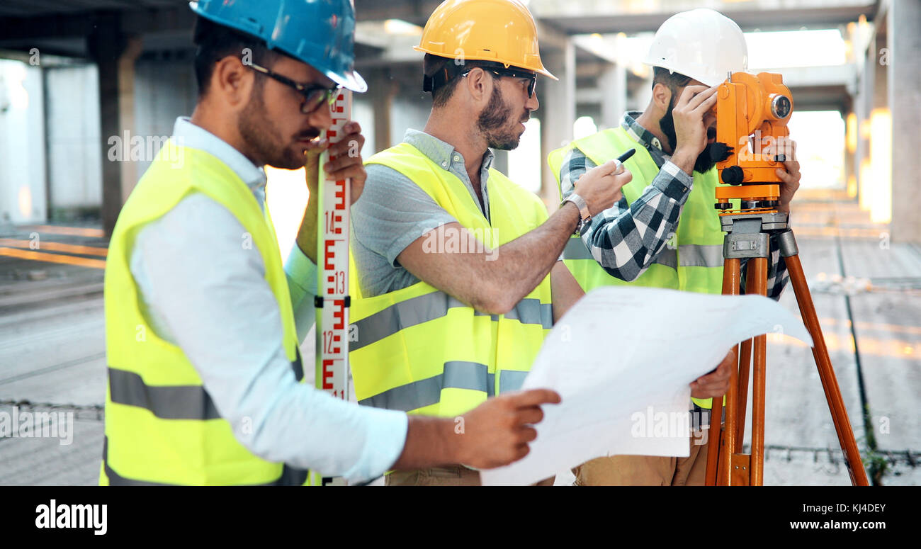 Portrait of construction engineers working on building site Stock Photo ...