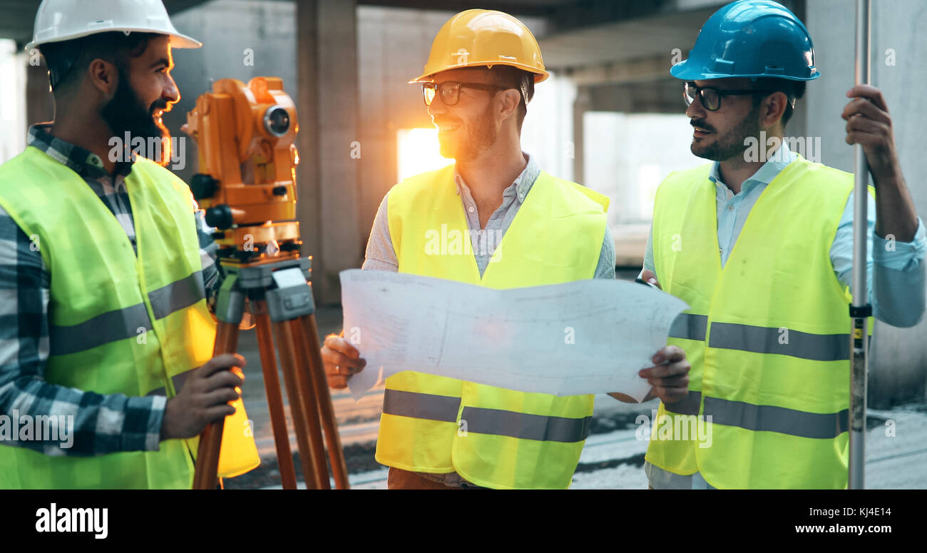 Portrait of construction engineers working on building site Stock Photo ...
