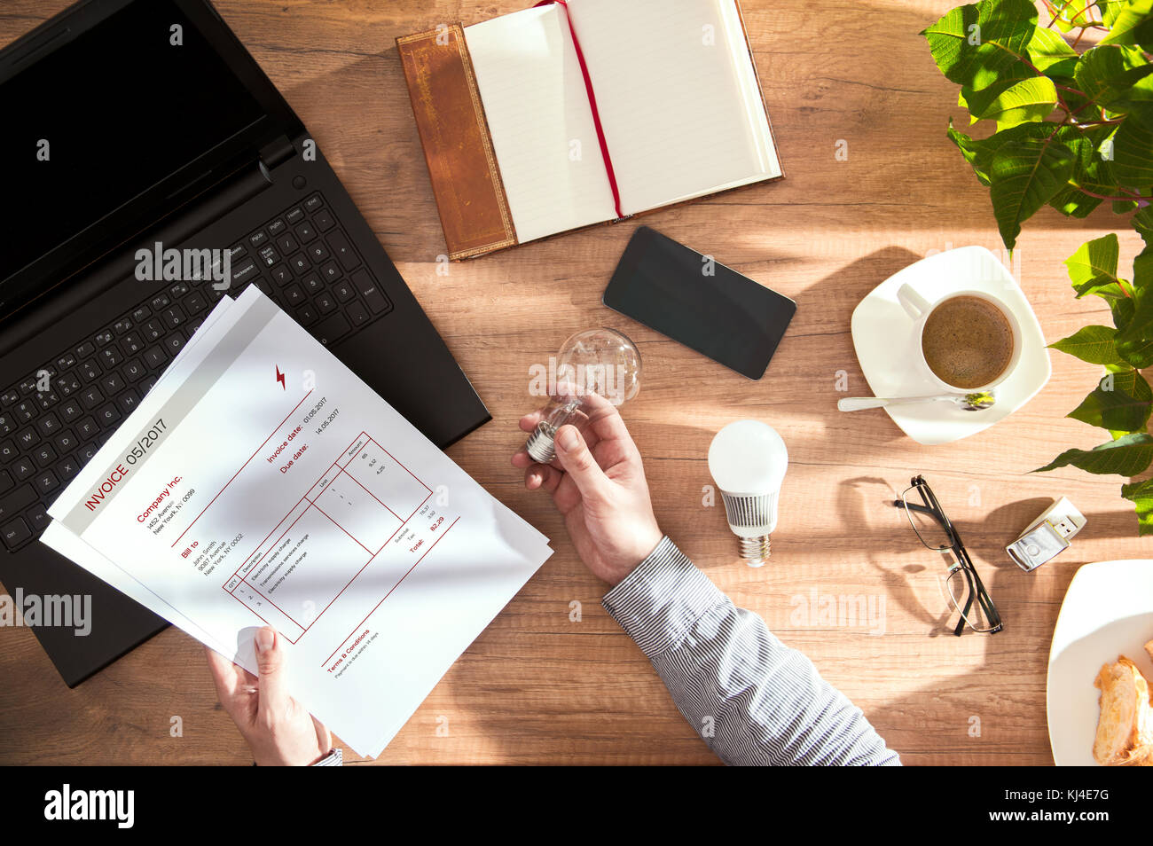 Man wonders how to reduce electricity bill amount Stock Photo - Alamy