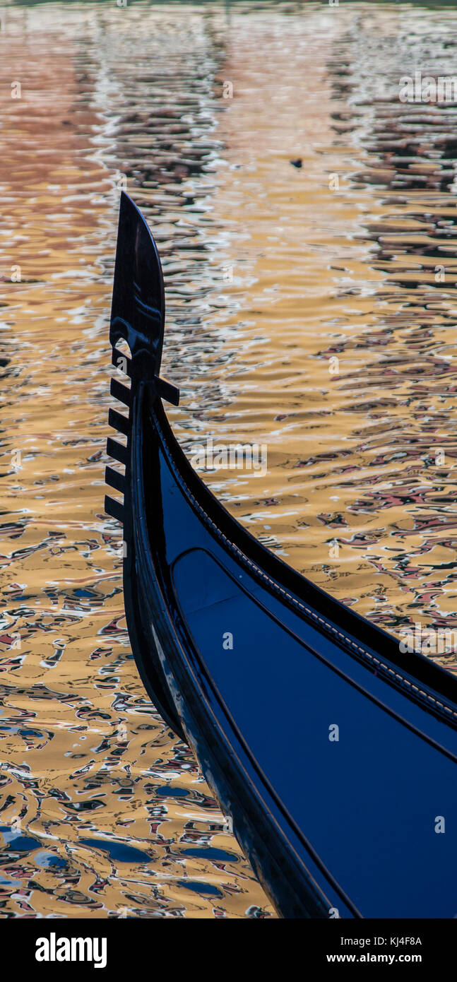Gondola with colorful abstract reflection of buildings in the canal in ...