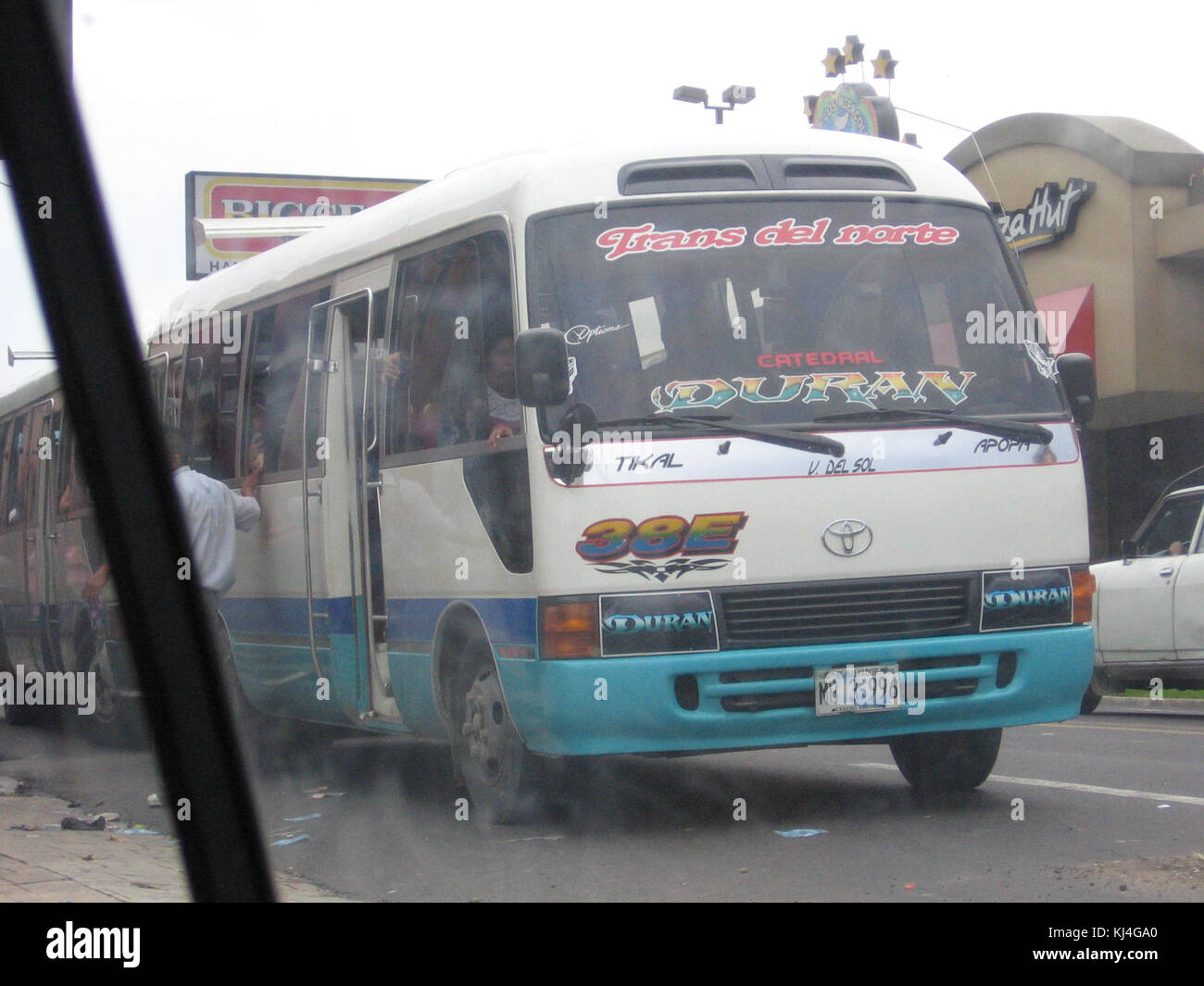A microbus, a small vehicle designed for passenger transport, commonly ...