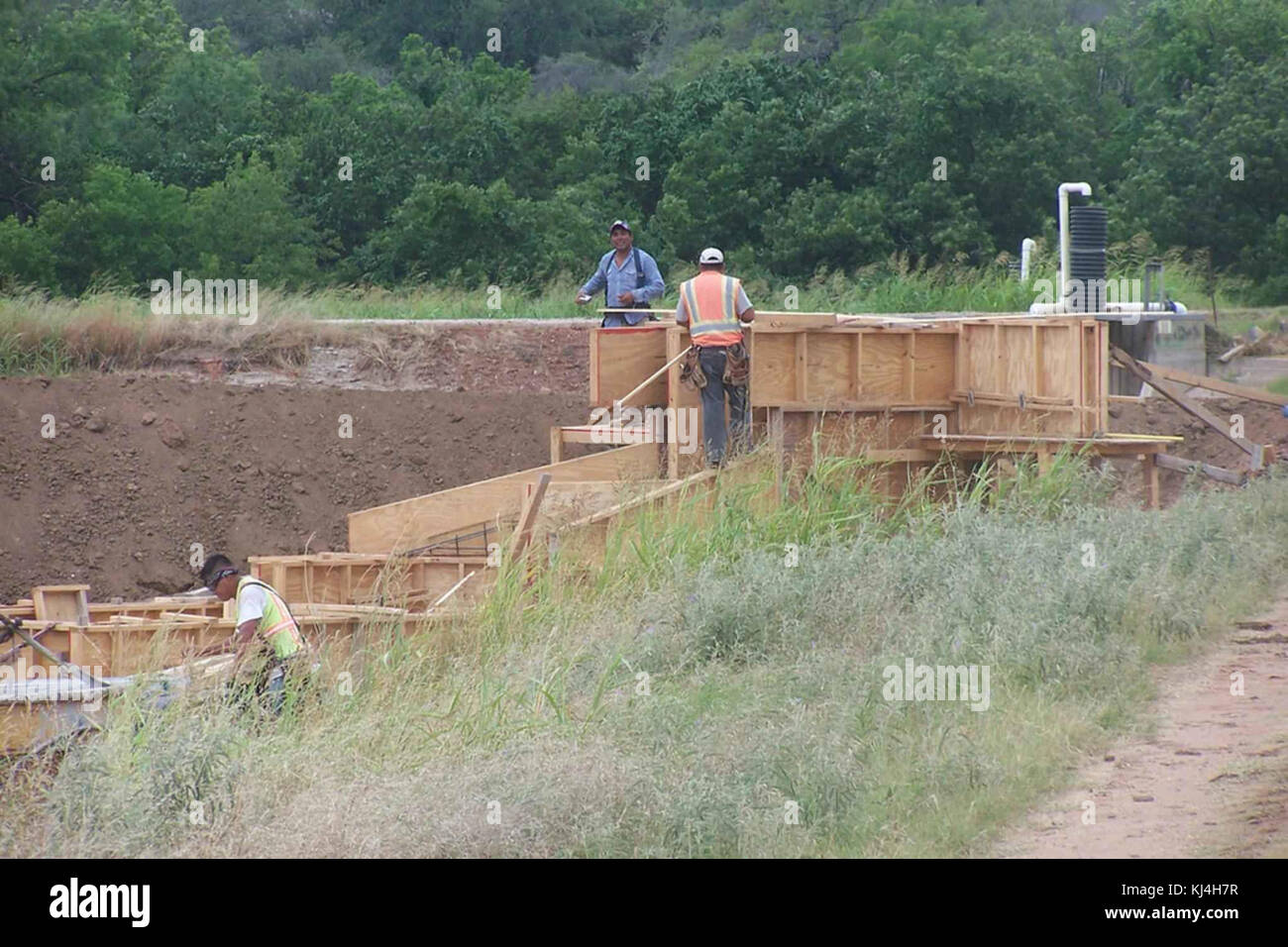 Professional builders using manual hi-res stock photography and images ...