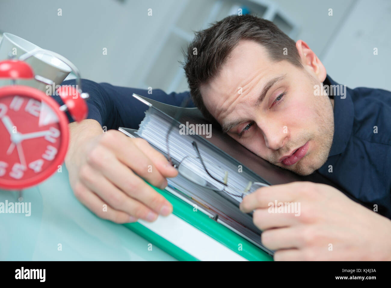 Slumped at desk hi-res stock photography and images - Alamy