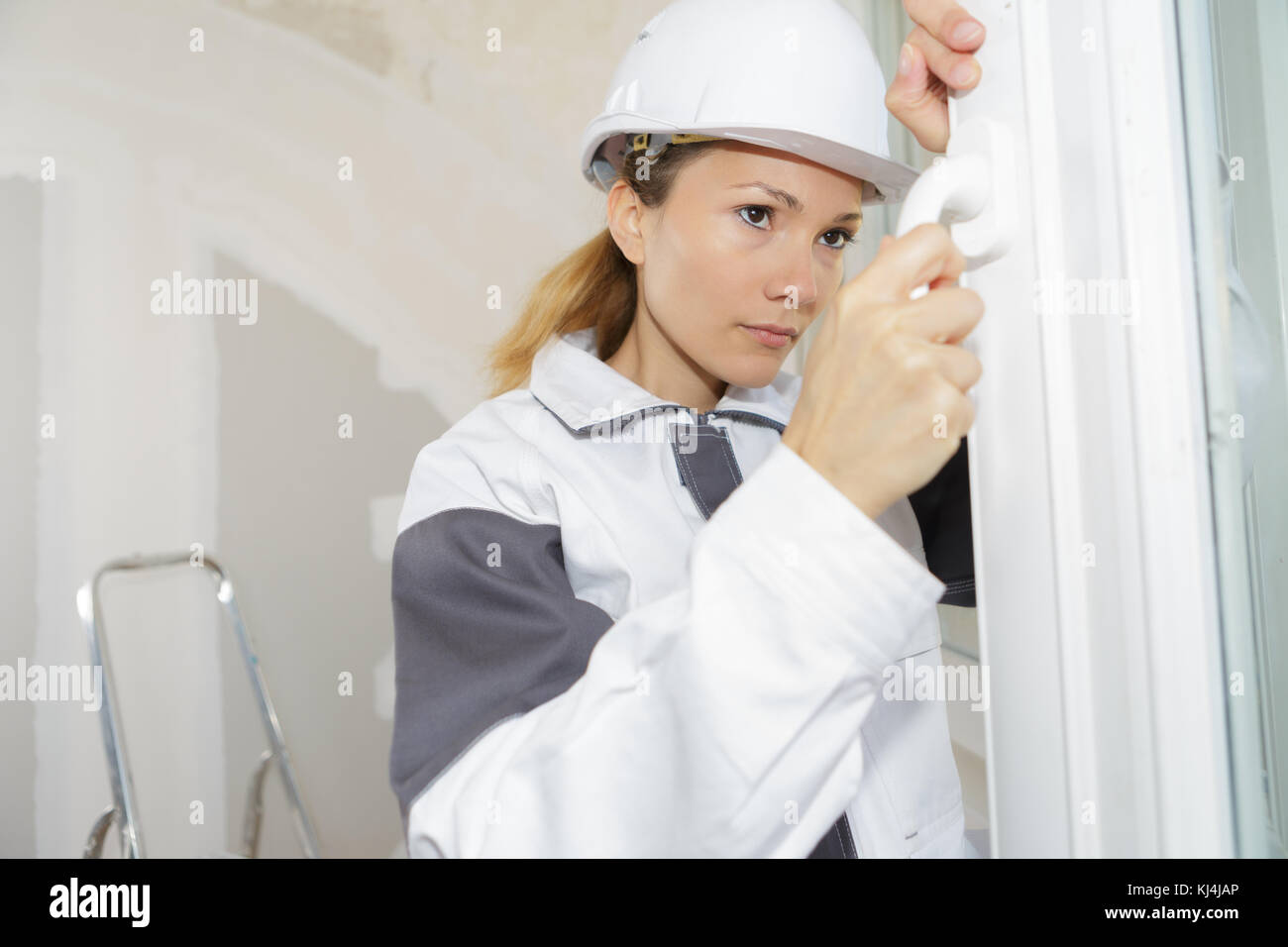female plasterer at indoor wall work Stock Photo - Alamy