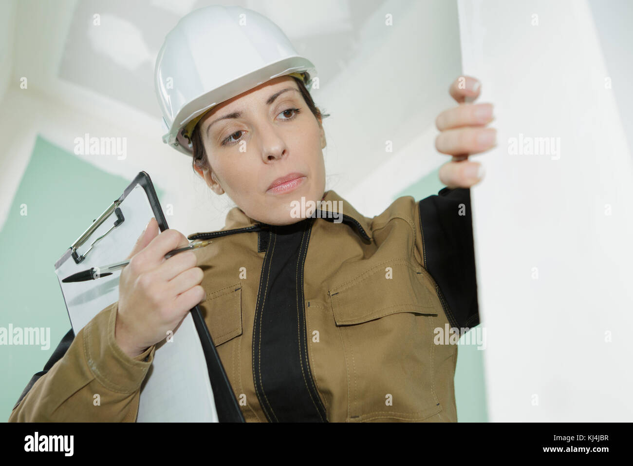 woman checking quality of work Stock Photo - Alamy