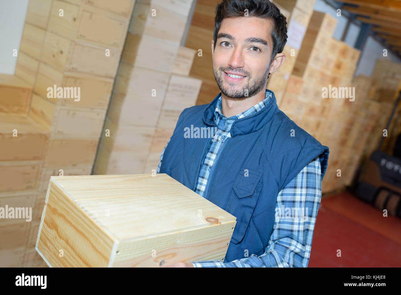 handsome packer on the packaging line at the manufacture Stock Photo ...