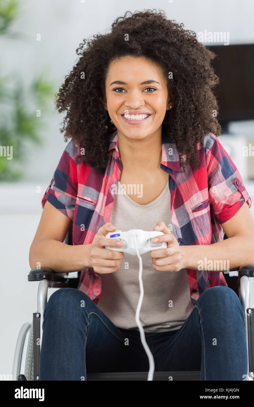 beautiful disabled young woman playing video gales Stock Photo - Alamy