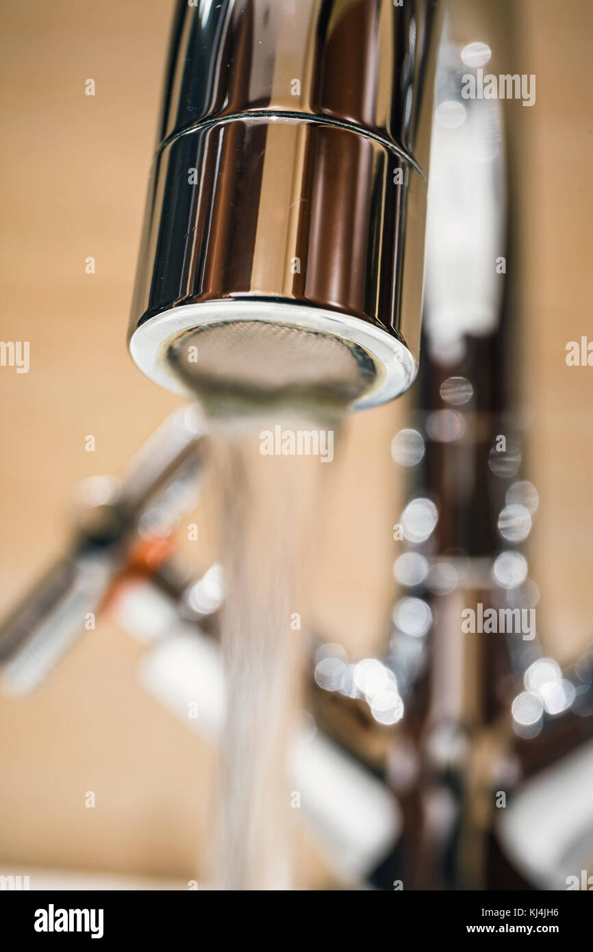 Water tap with modern design in bathroom Stock Photo - Alamy