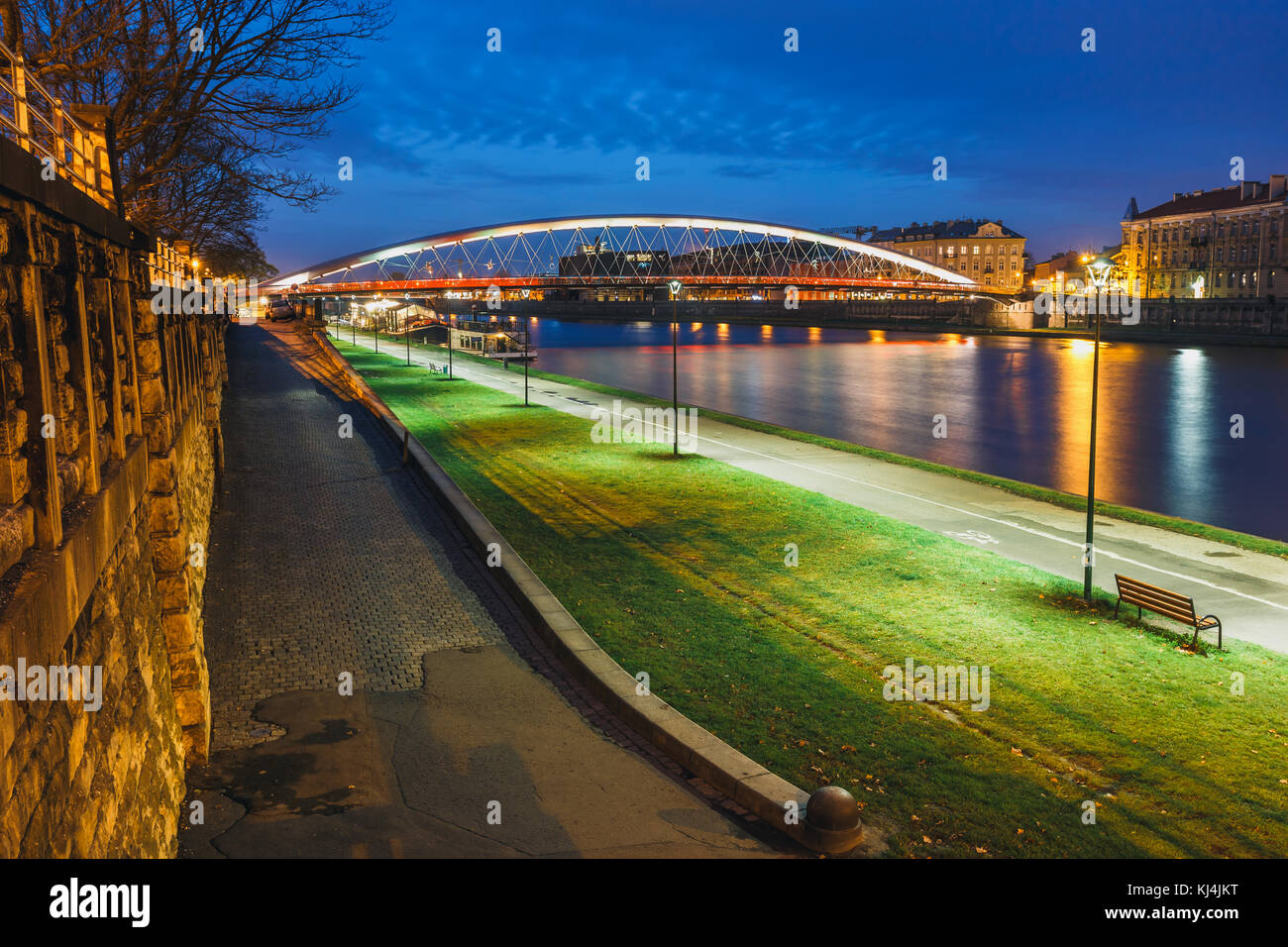 Bernatka footbridge over Vistula river in the night in Krakow, Poland ...