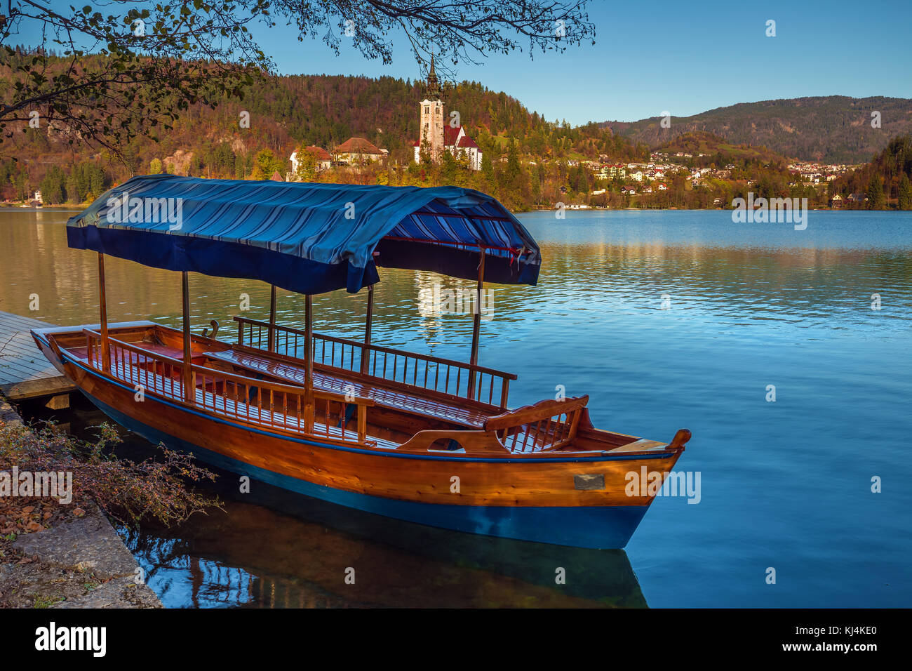 Bled, Slovenia - Traditional blue Pletna boat at Lake Bled with ...