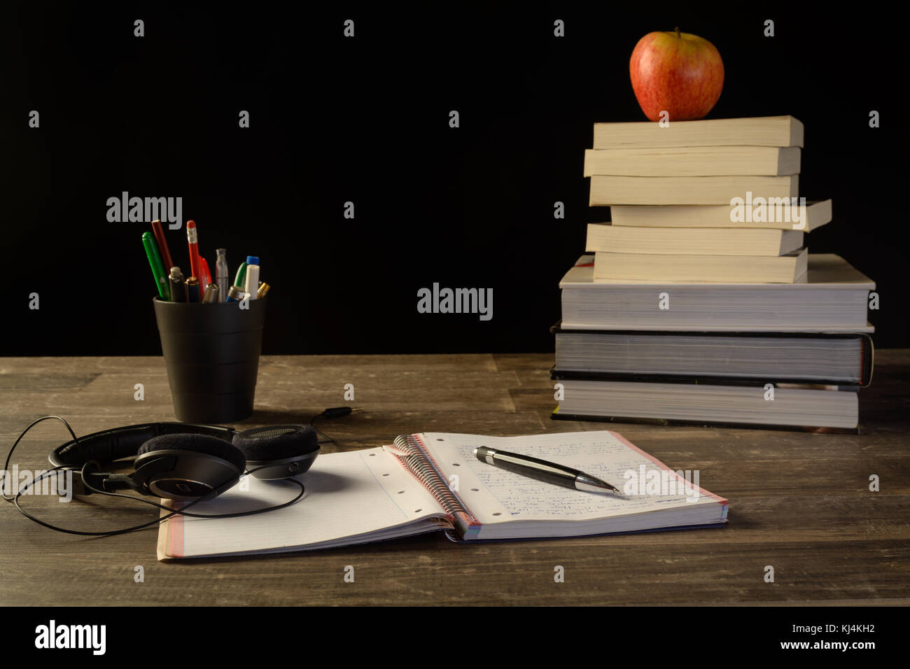 study table desk with books a open sketch book and pencil bucket ...
