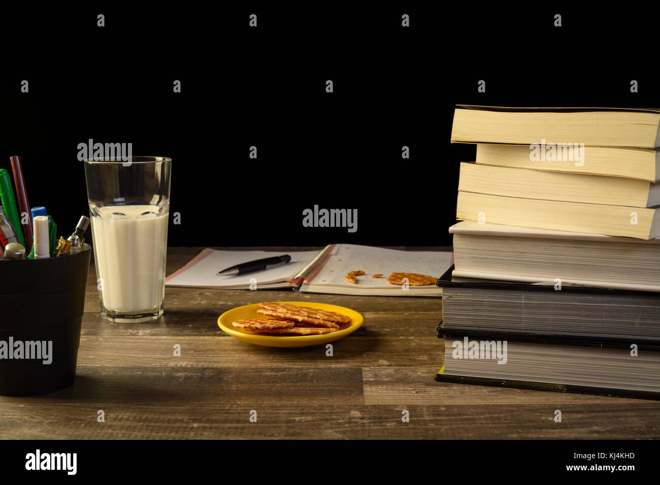 study table desk with books a open sketch book and pencil bucket ...