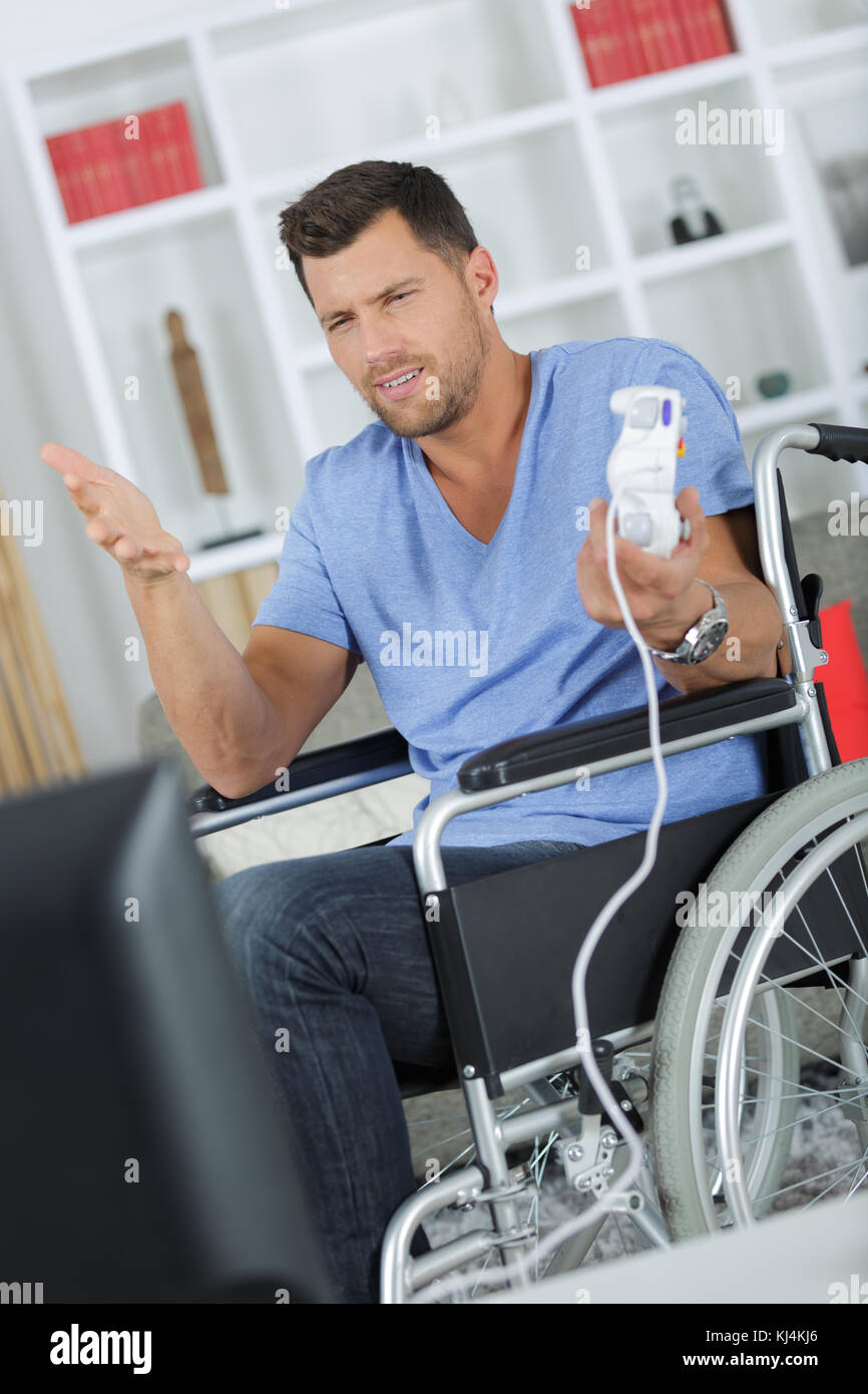 disabled man on the wheelchair holding a joystick Stock Photo - Alamy