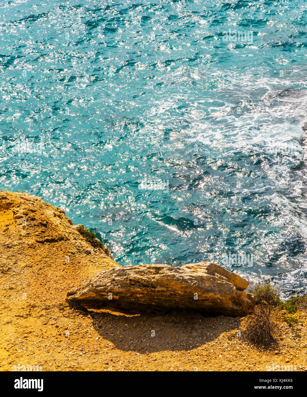 high cliff above the sea, summer sea background, many splashing waves ...