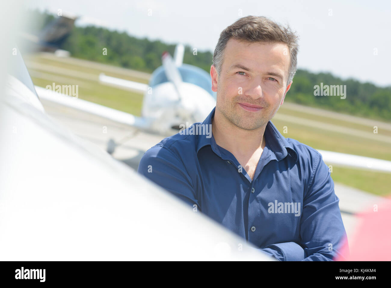 man with an airplane in the background Stock Photo - Alamy