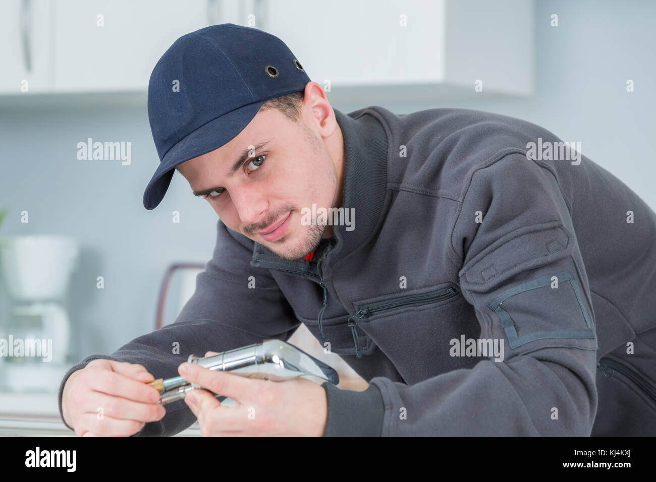 Portrait of plumber in residential setting Stock Photo - Alamy