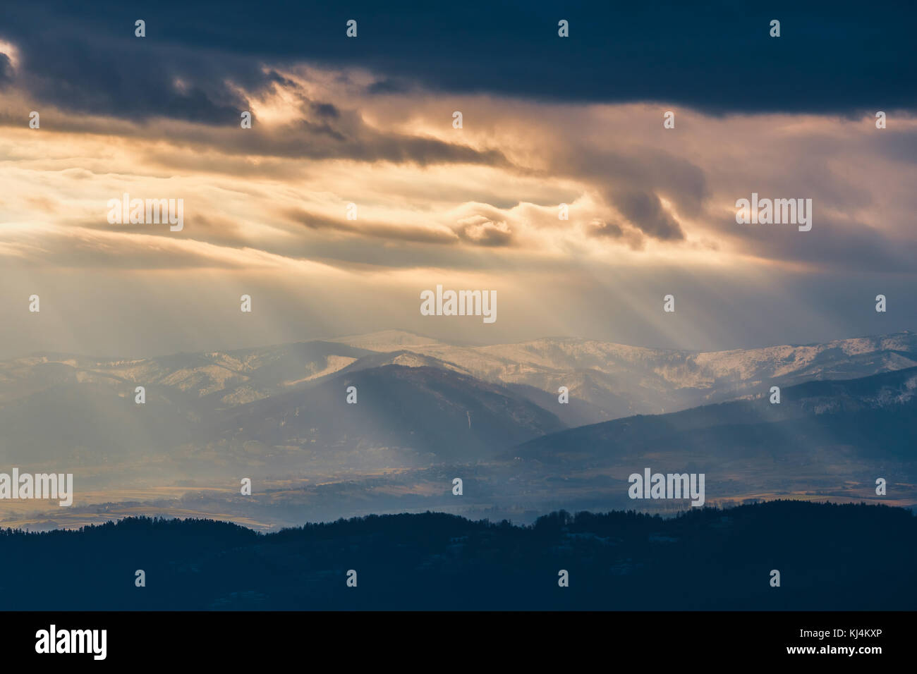 Rays of light pass through the clouds, mountain landscape Stock Photo ...