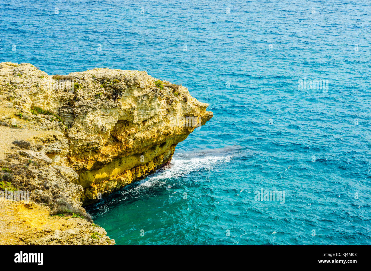 high cliff above the sea, summer sea background, many splashing waves ...