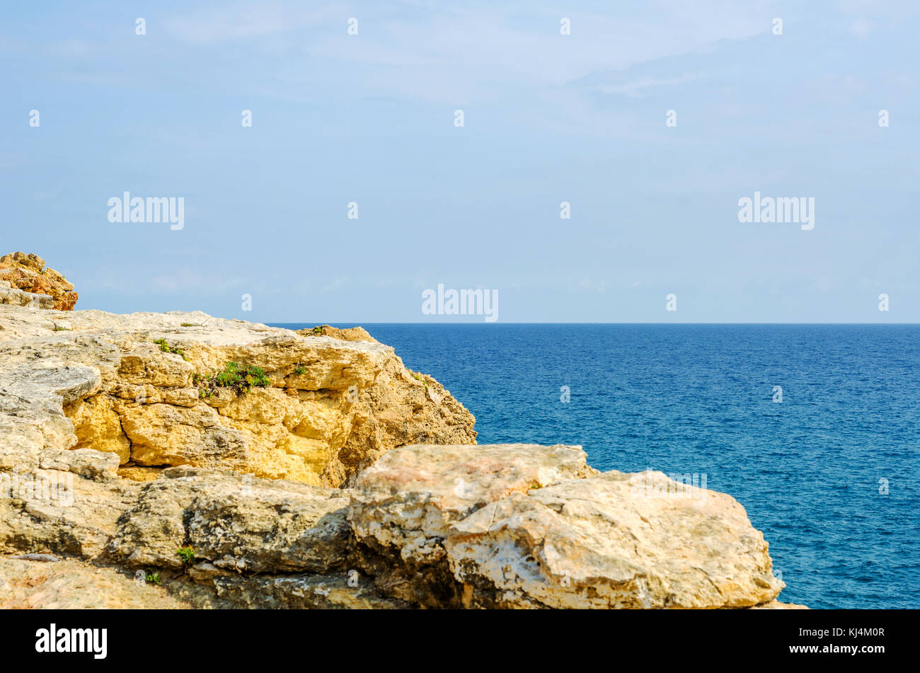 high cliff above the sea, summer sea background, many splashing waves ...