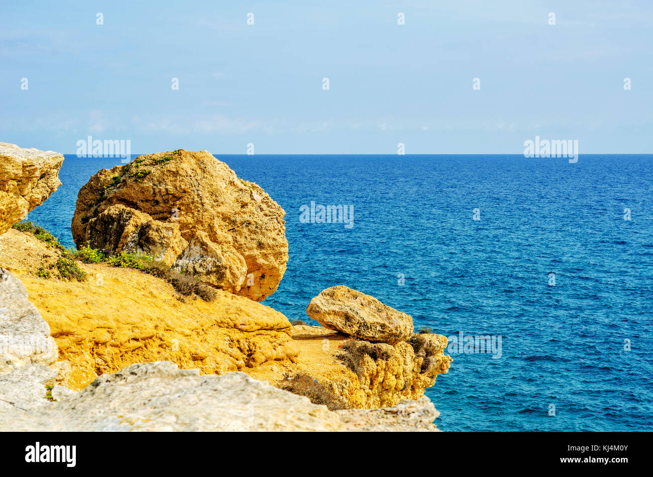 high cliff above the sea, summer sea background, many splashing waves ...