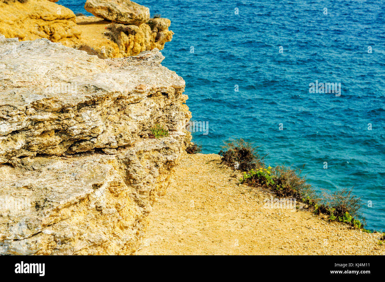 high cliff above the sea, summer sea background, many splashing waves ...