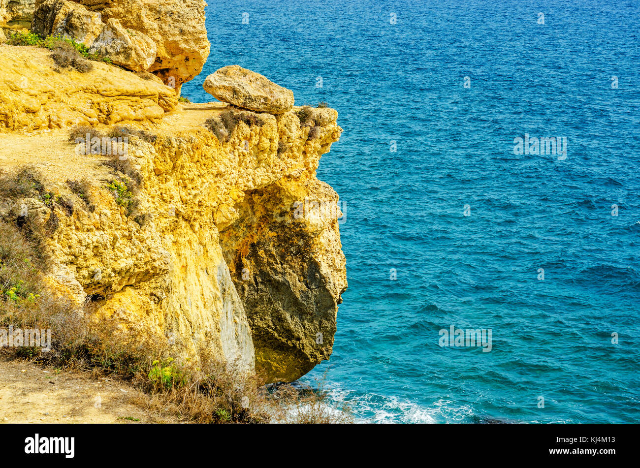 high cliff above the sea, summer sea background, many splashing waves ...