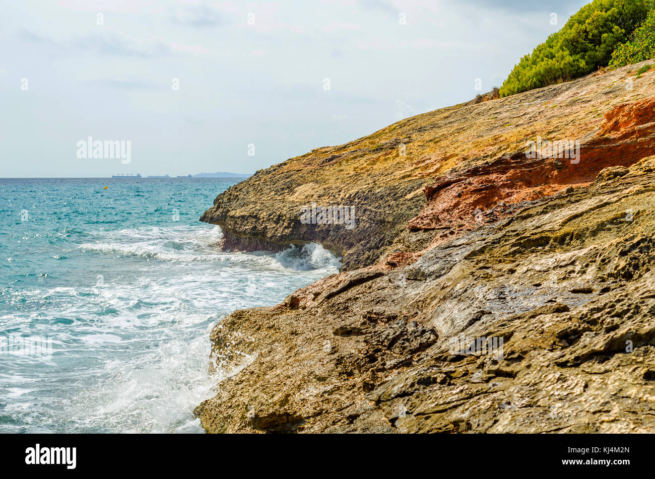 high cliff above the sea, summer sea background, many splashing waves ...
