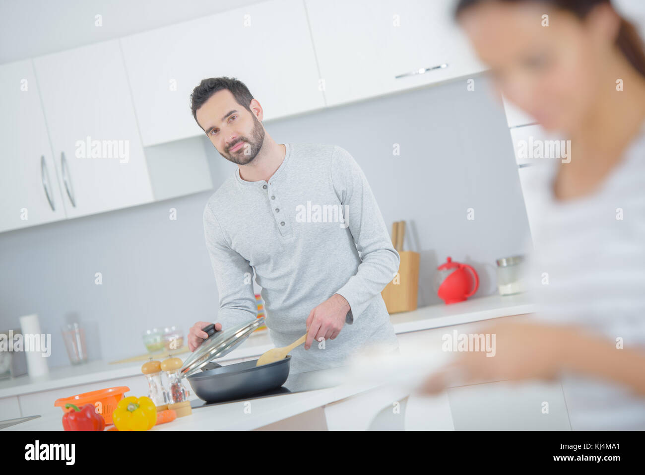 Husband cooking for his wife Stock Photo - Alamy