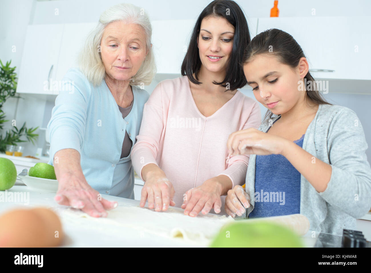 happy family of three generations cooking together Stock Photo - Alamy