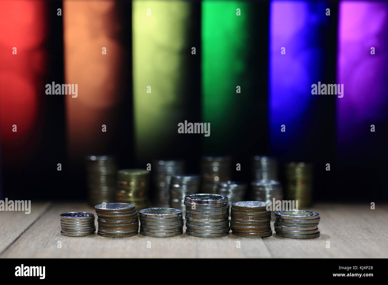coin stack with LGBT rainbow color background. Business, finance and ...