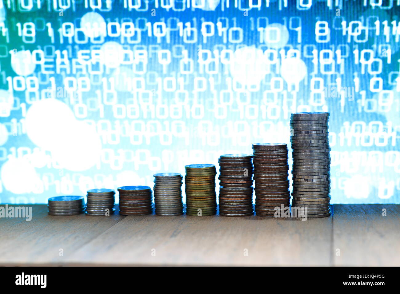 Digital economy. Coin stack with blue binary digital numbers background ...