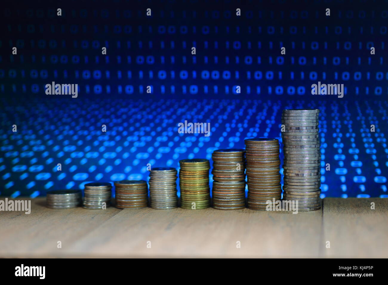Digital economy. Coin stack pyramid shape with digital binary code in ...
