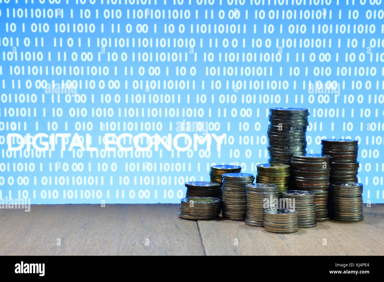 Digital economy. Coin stack pyramid shape with digital economy text and ...