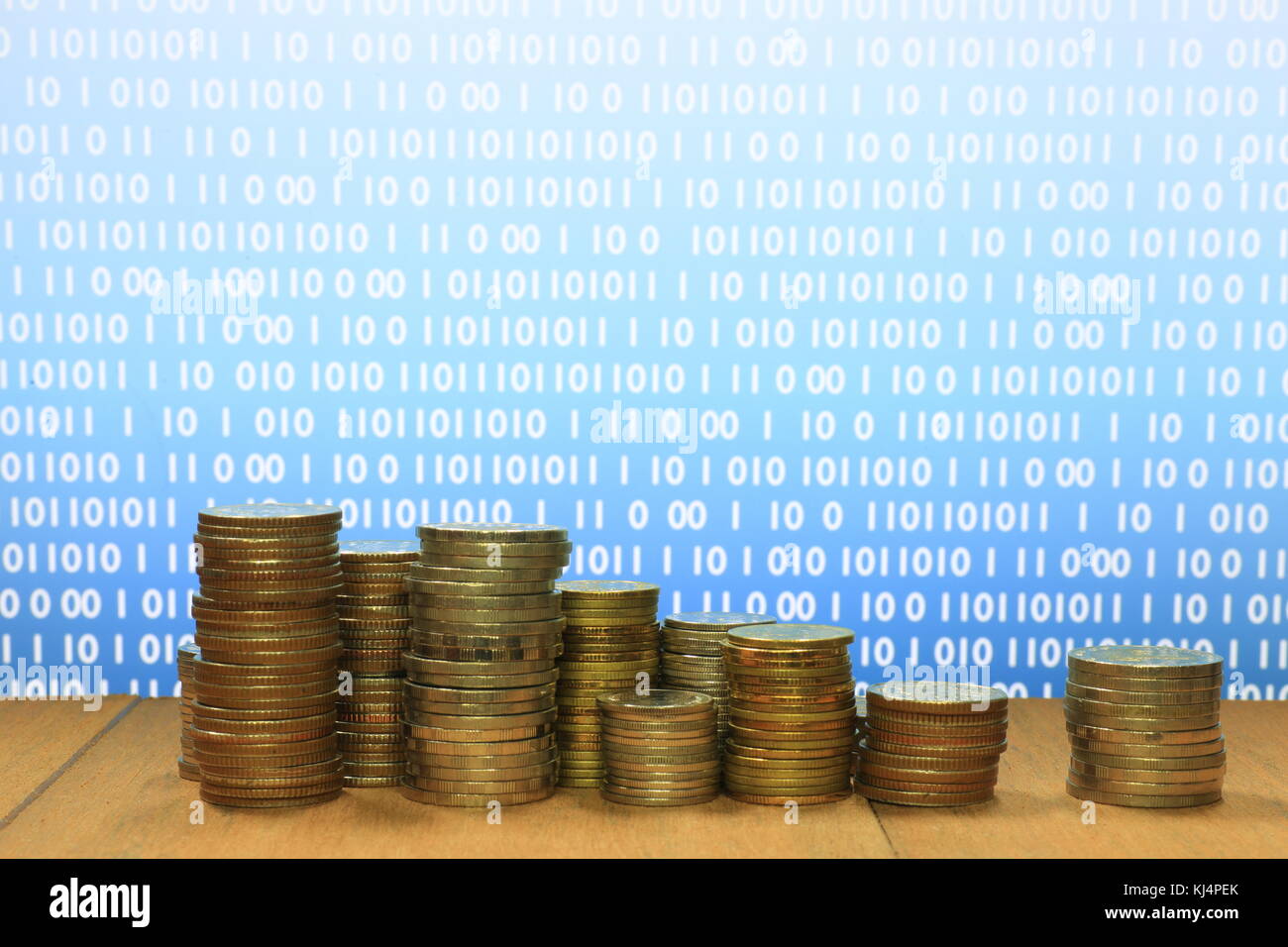 Digital economy. Coin stack with blue binary digital numbers background ...